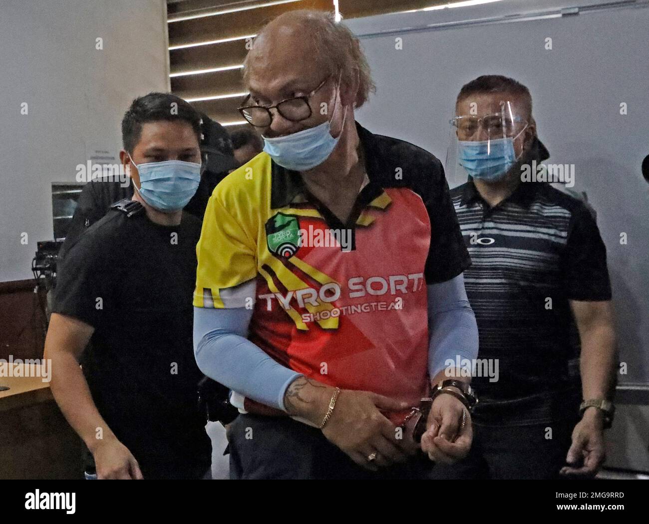 Former Rep. Ruben Ecleo Jr., center, walks inside the National Capital ...