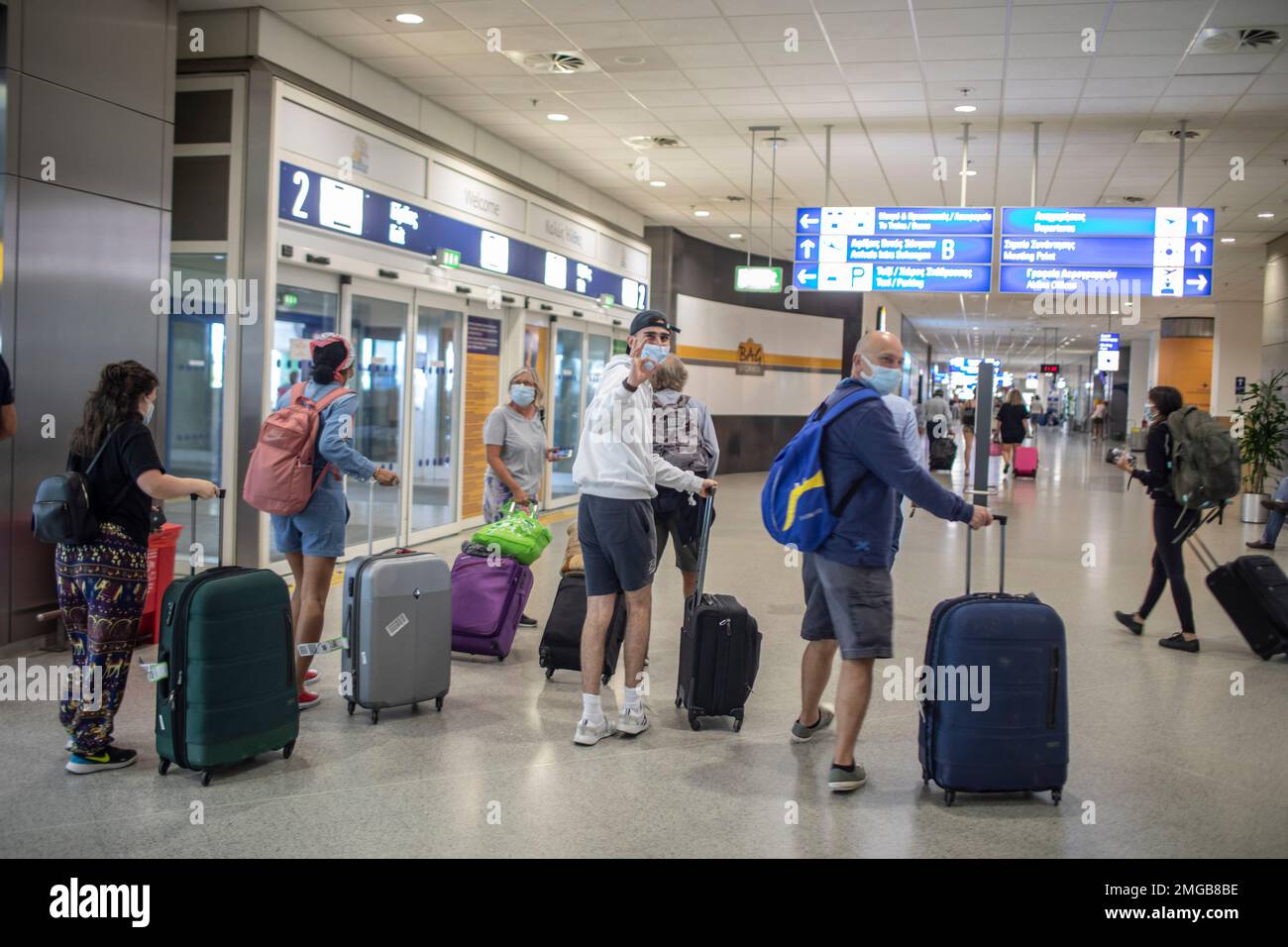 Tourists from the United Kingdom arrive at Athens International Airport ...
