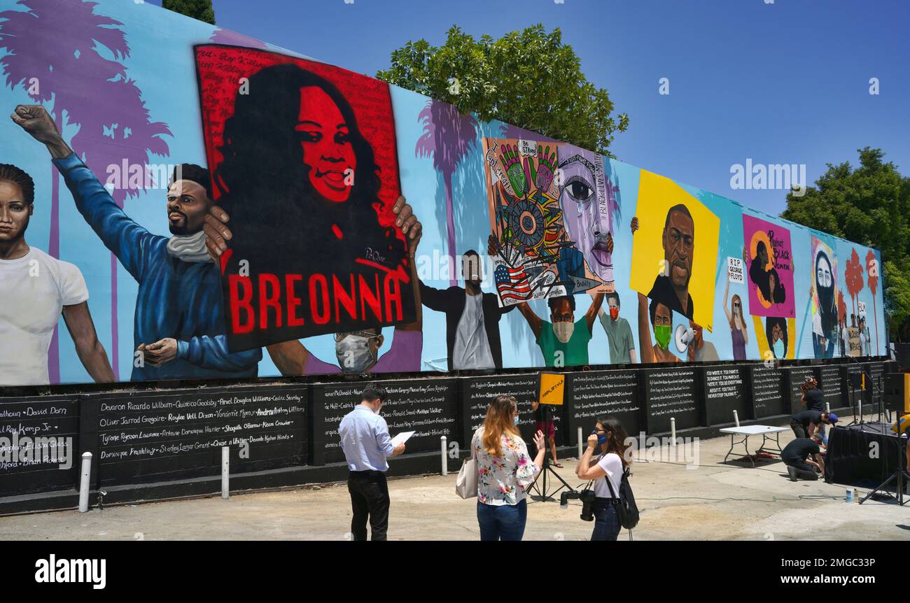 Visitors arrive for the unveiling of a 148-foot tribute mural to Black ...