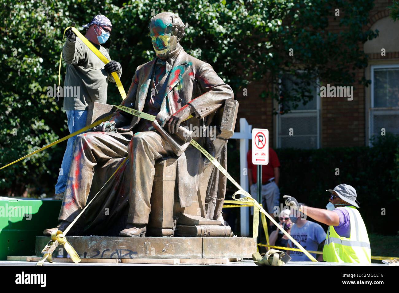 Workers secure the statue of Confederate Naval officer Matthew Fontaine ...