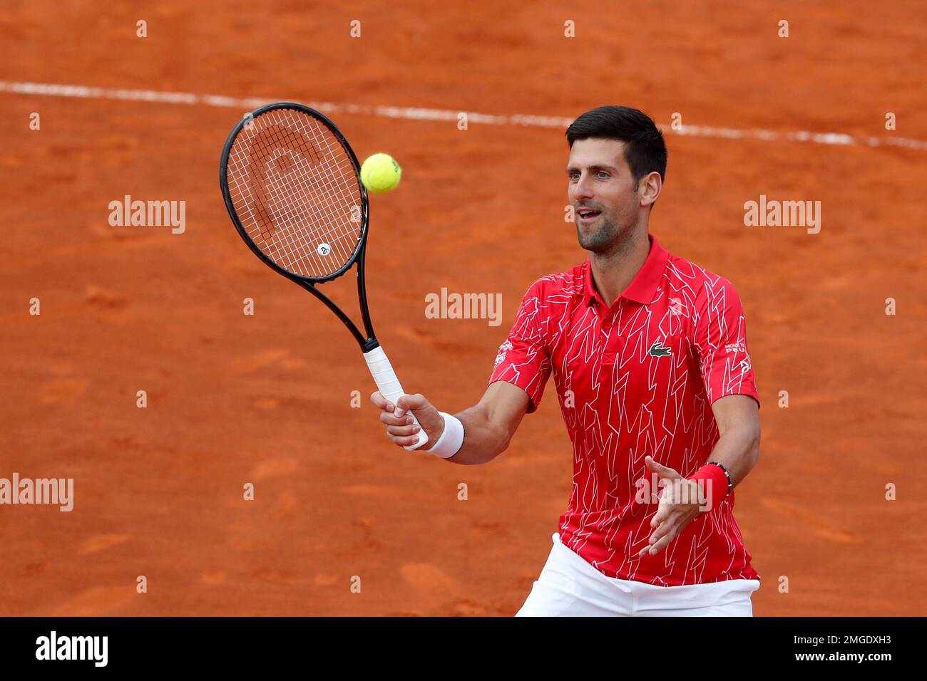Serbia's Novak Djokovic returns the ball during a tennis doubles match ...