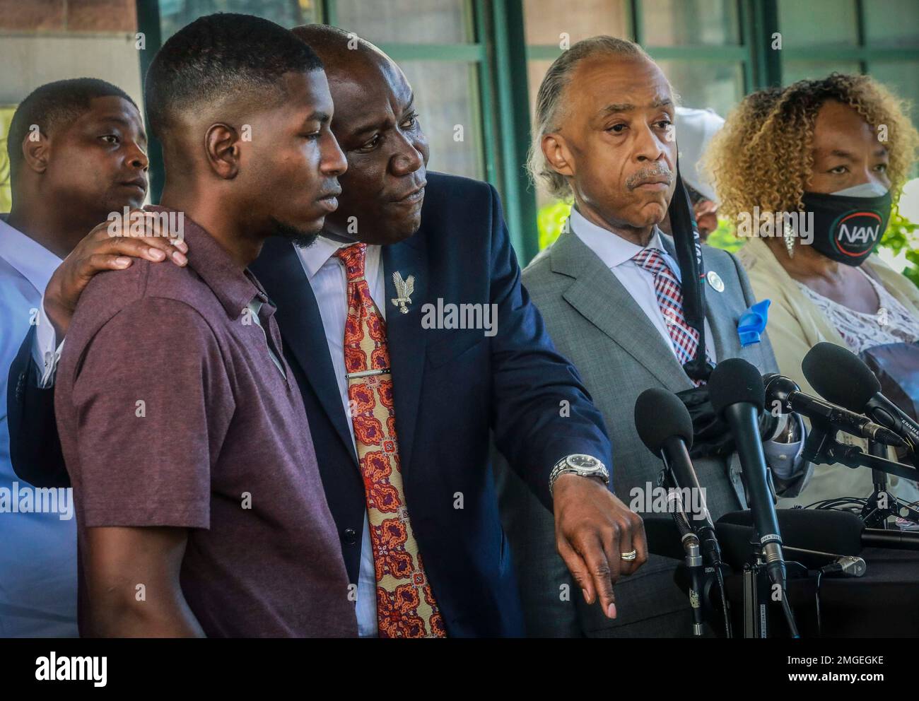 Quincy Mason Floyd, second from left, holds a news conference with his ...