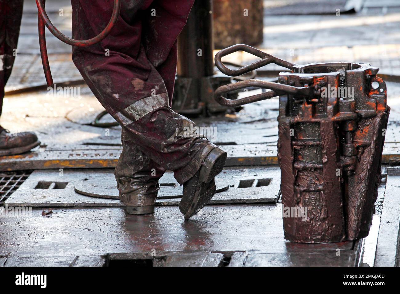 FILE - In this Sept. 18, 2010 file photo, the work suits and boots of ...
