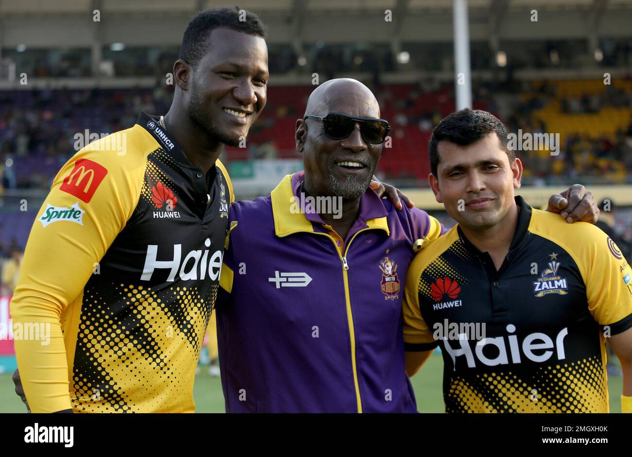 Peshawar Zalmi's players Darren Sammy, left, and Kamran Akmal, right ...