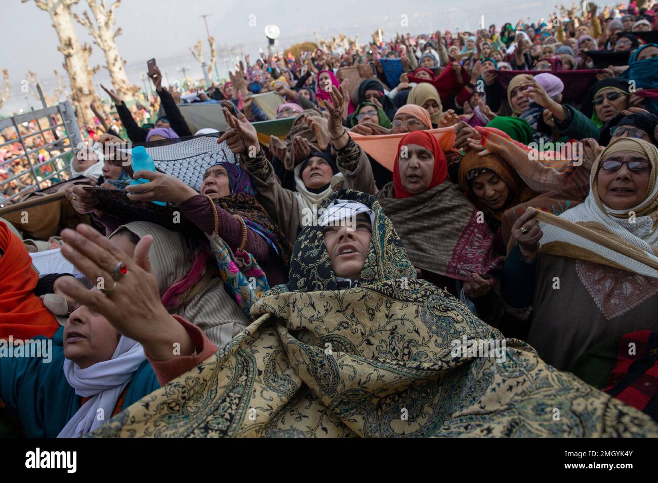 Kashmiri Muslim devotees pray as a head priest displays a relic ...