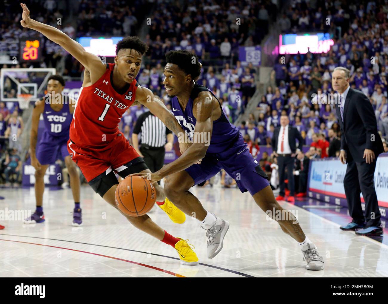 TCU guard RJ Nembhard, right, drives to the basket against Texas Tech ...