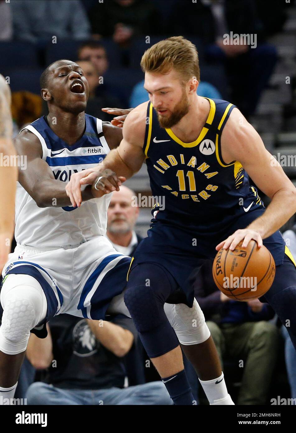 Indiana Pacers' Domantas Sabonis, right, of Lithuania, drives around ...