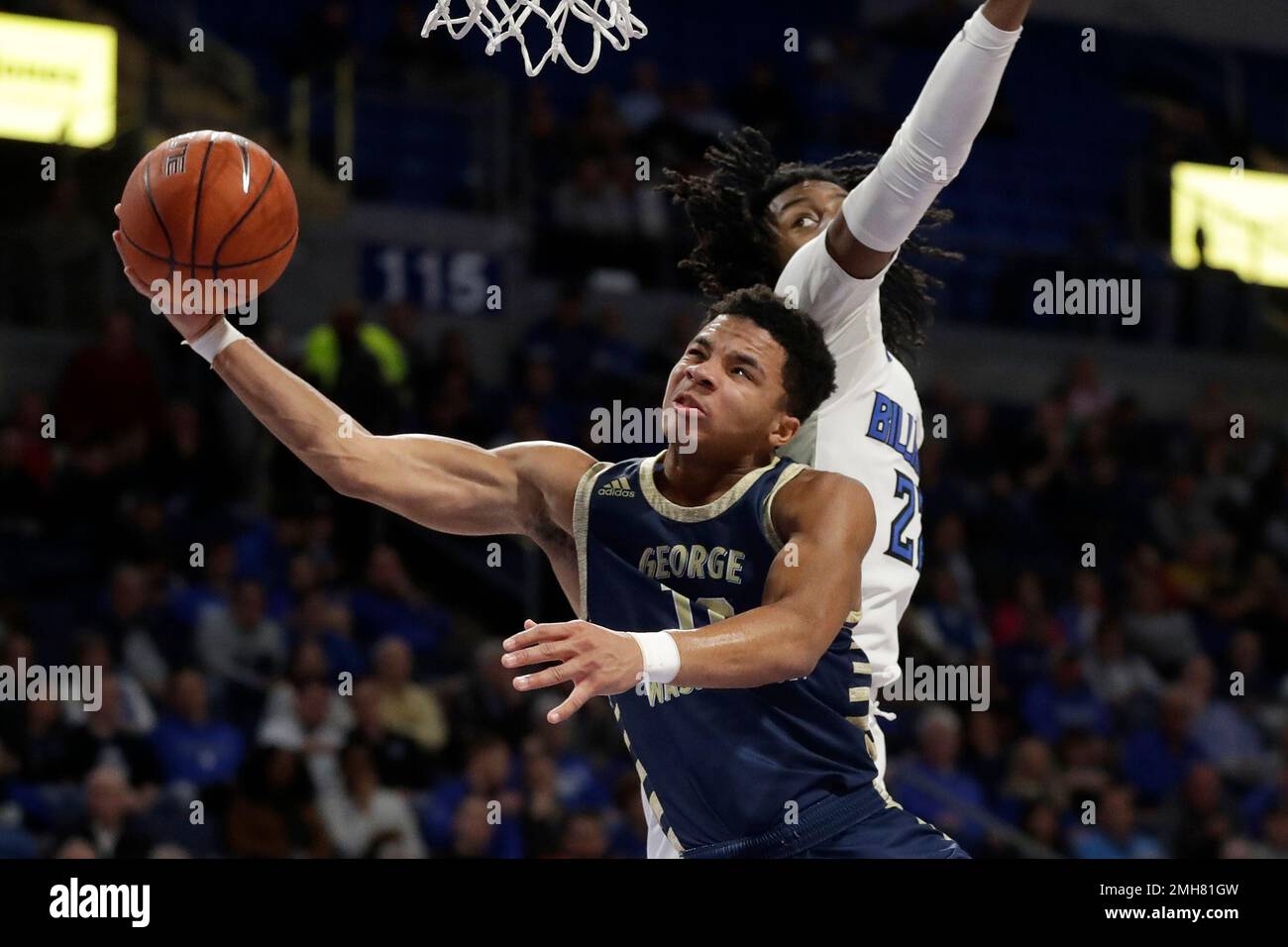 George Washington's Jameer Nelson Jr., front, heads to the basket as ...