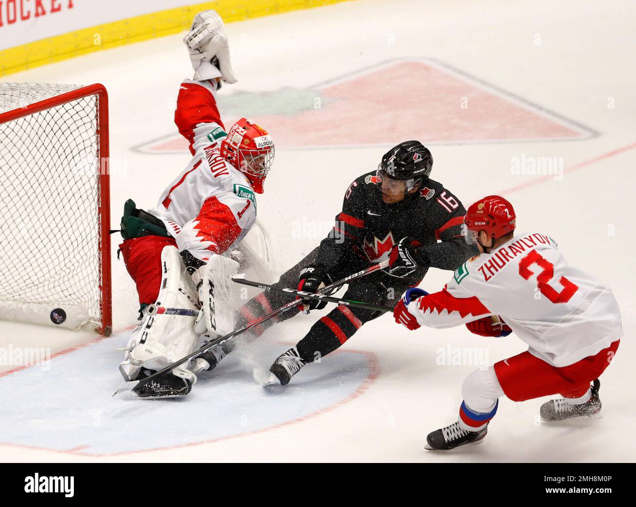 Canada's Akil Thomas, center, scores his sides winning goal past Russia ...
