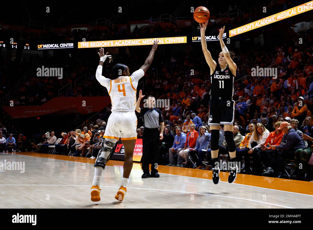 UConn forward Lou Lopez Senechal (11) shoots over Tennessee guard ...