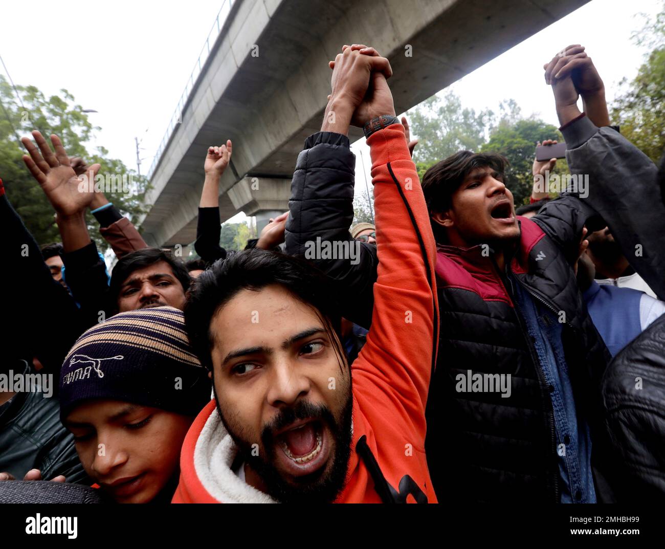 Indian students of the Jamia Millia Islamia University shout slogans ...