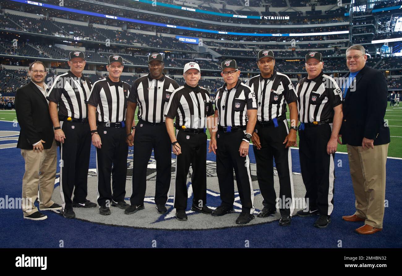 NFL game officlals, from left, replay official Brian Matoren, down ...