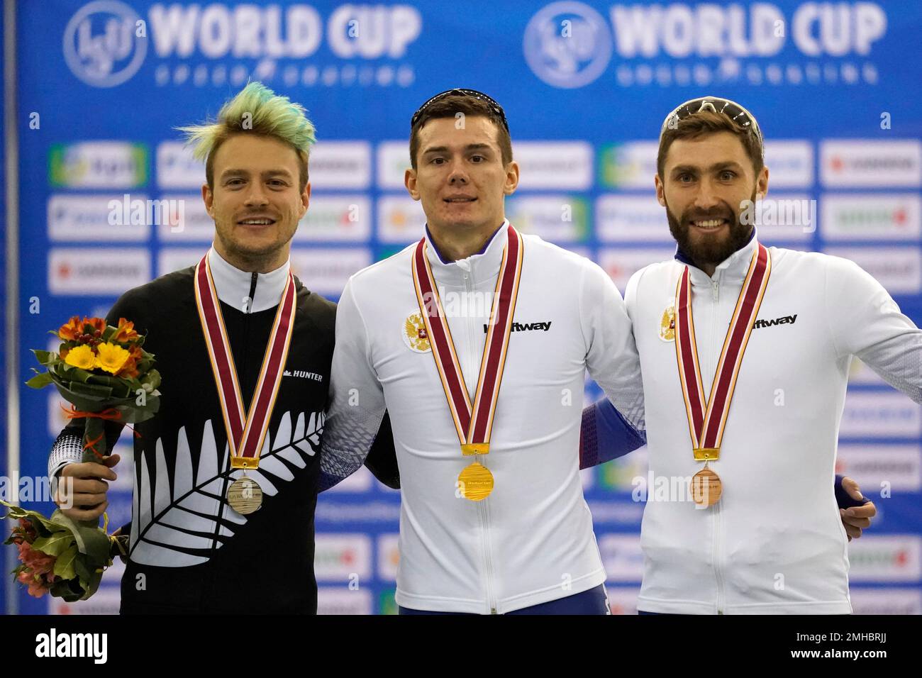 From left, silver medalist New Zealand's Peter Michael, gold medalist Russia's Danila Semerikov ...