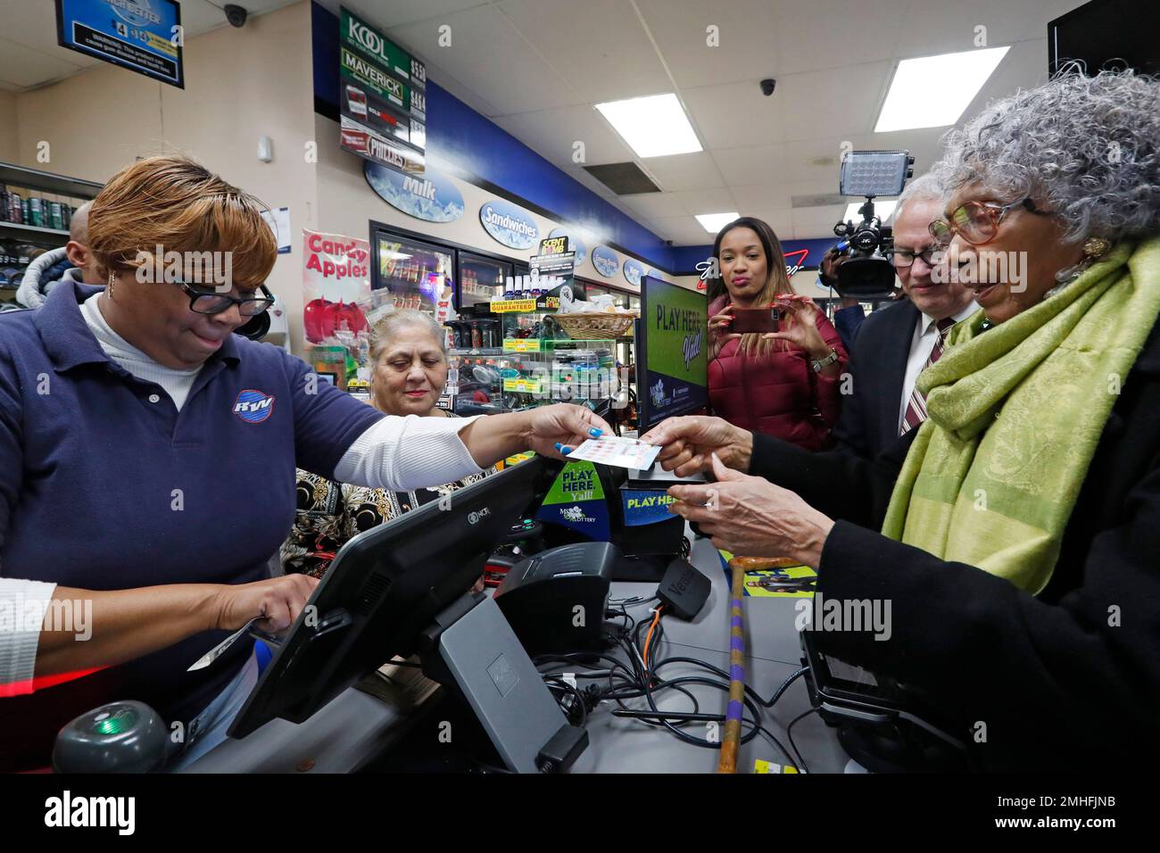 Rep. Alyce Clarke, D-Jackson, right, flanked by Mississippi Lottery ...