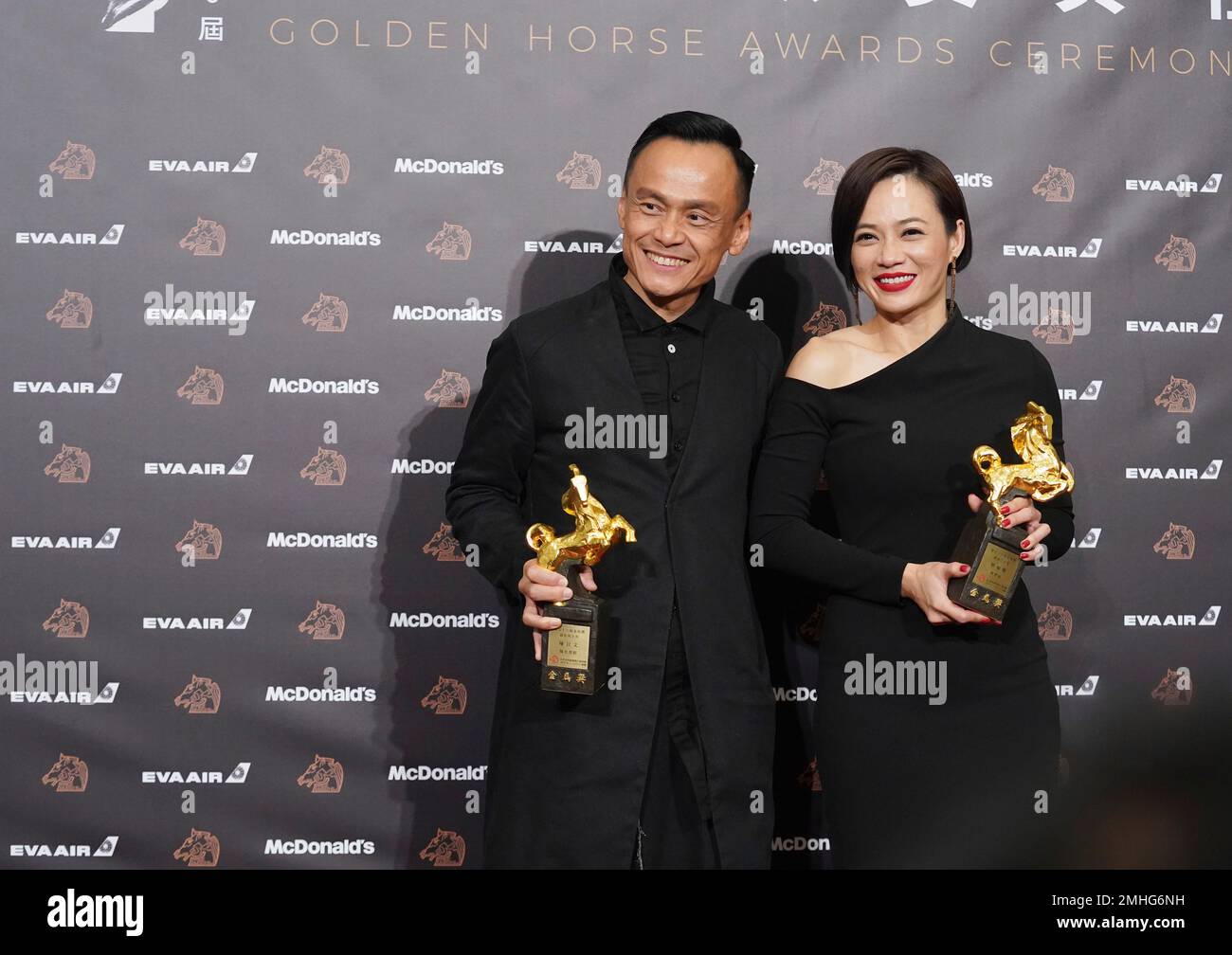 Malaysian actress Yeo Yann-yann, right, and Taiwanese actor Chen Yi-wen hold their awards for ...