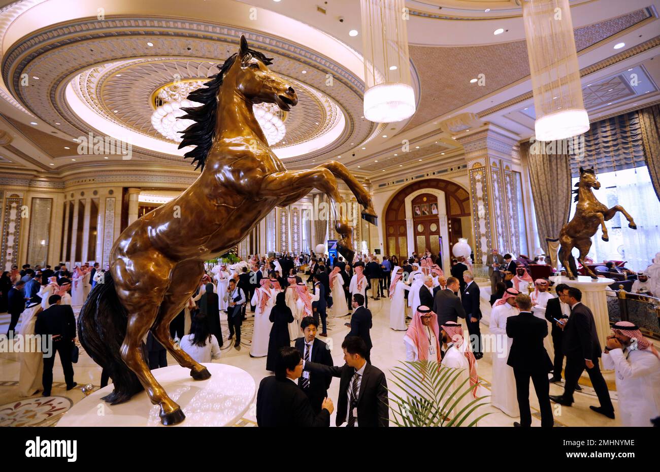 Participants of the Future Investment Initiative forum take a break in ...
