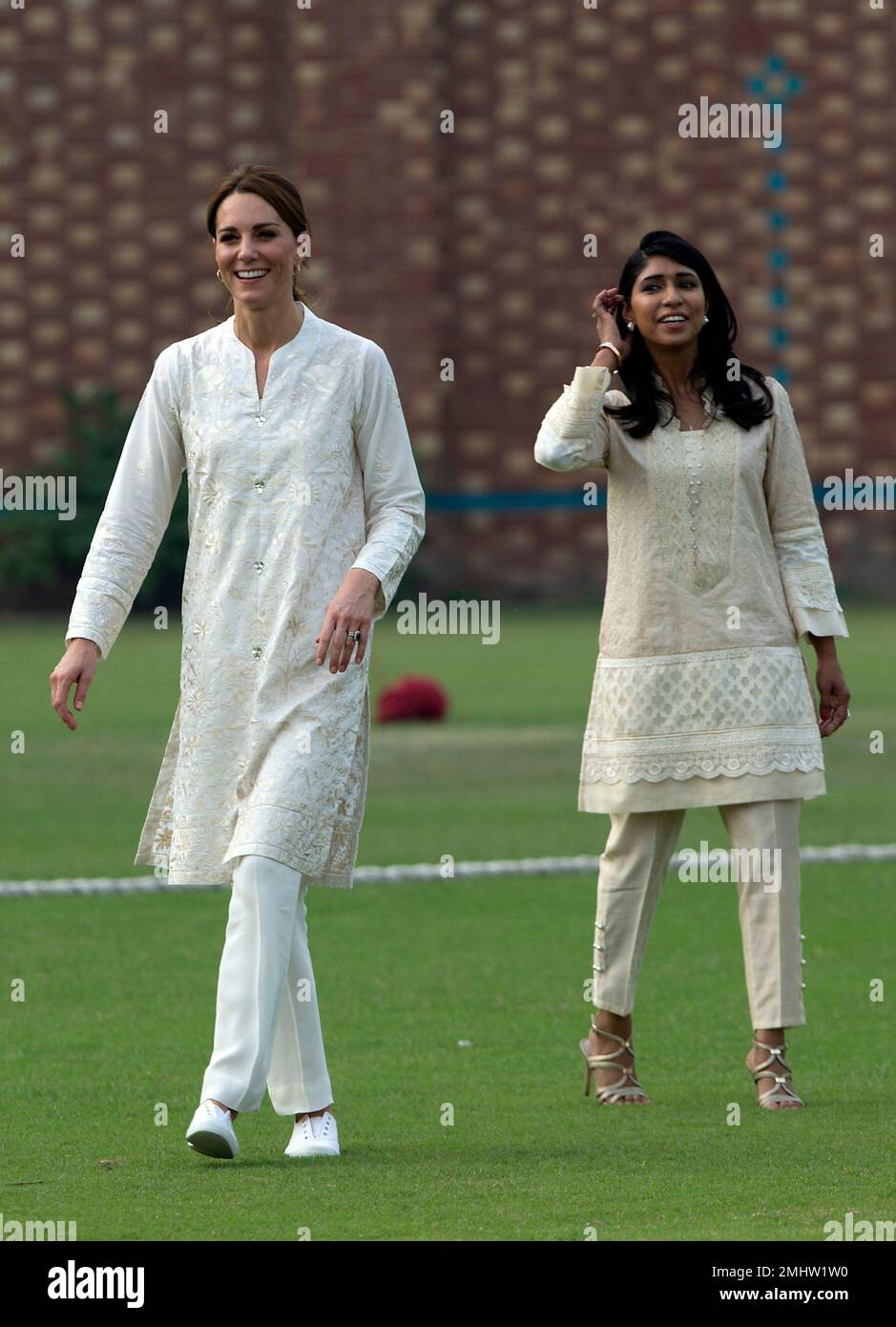 Britain's Kate, Duchess of Cambridge arrives with Urooj Mumtaz, right ...