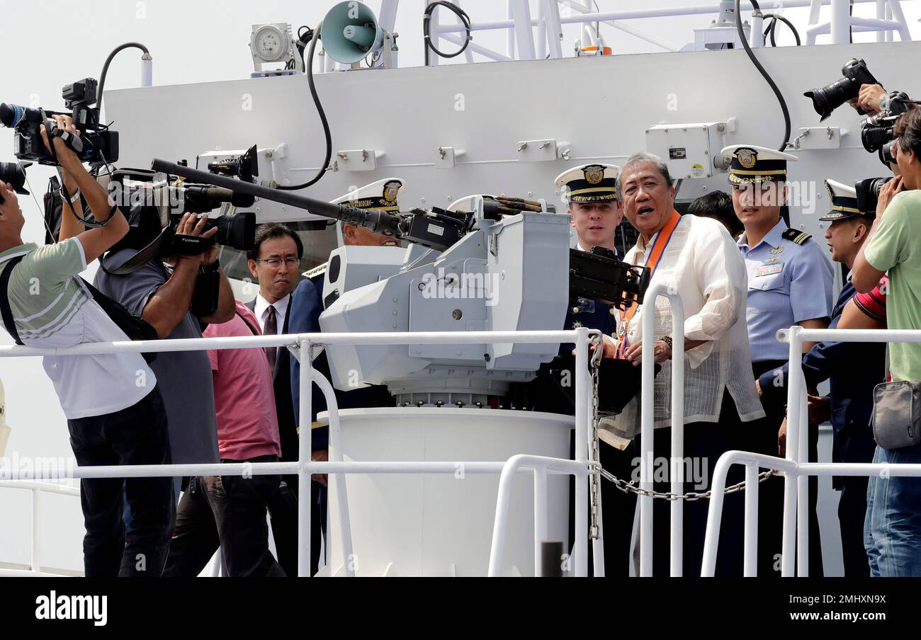 Philippine Transportation Secretary Arthur Tugade tries his hand behind ...