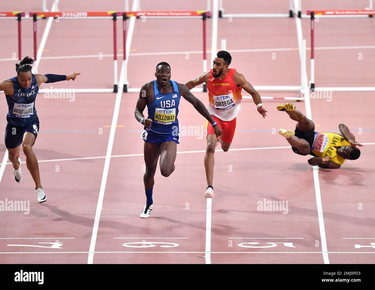 Gold medallist Grant Holloway, of the United States, second left ...
