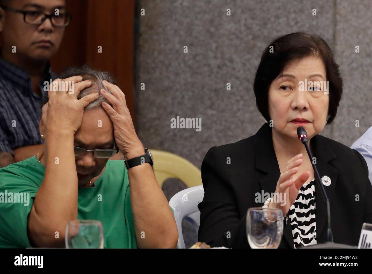 Iluminada Gomez, left, mother of slain student Allan Gomez, reacts ...
