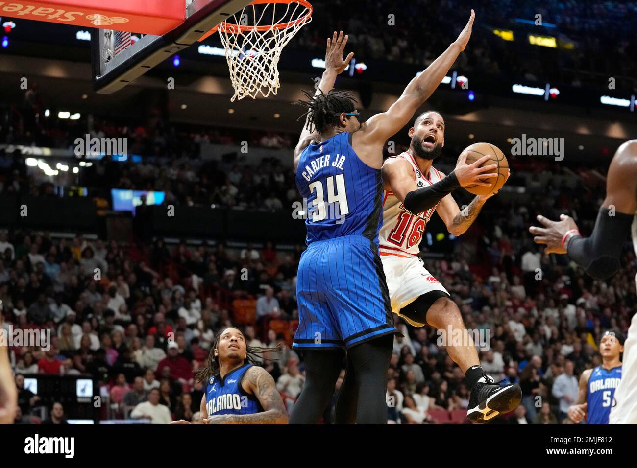 Miami Heat forward Caleb Martin (16) goes to the basket as Orlando ...