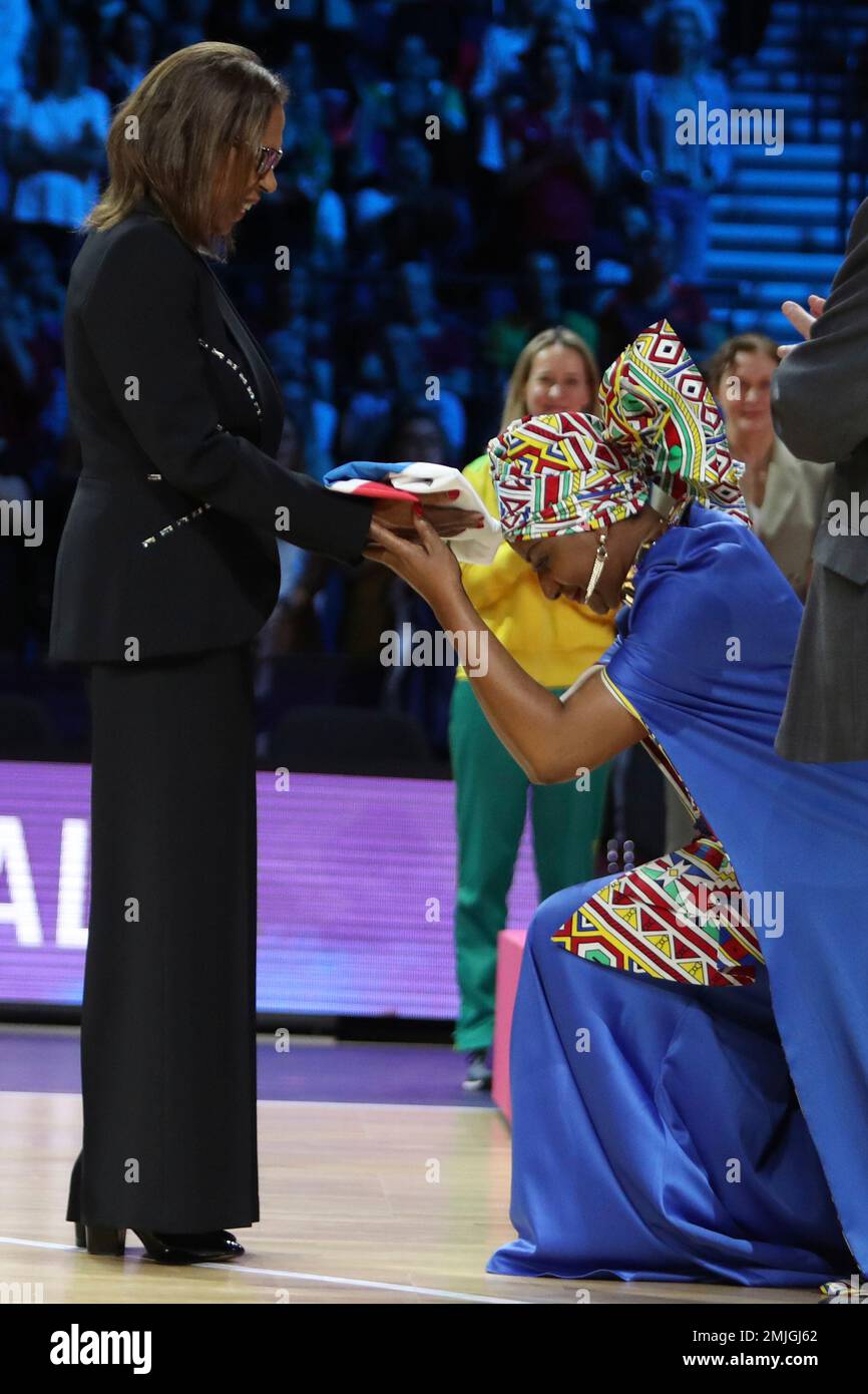International Netball Federation President Molly Rhone, left, presents ...