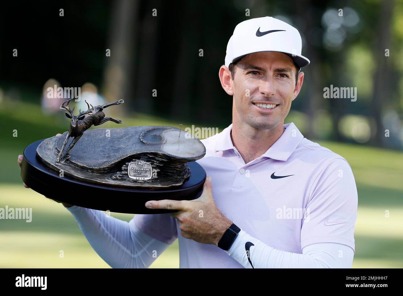 Dylan Frittelli holds the trophy after winning the John Deere Classic ...