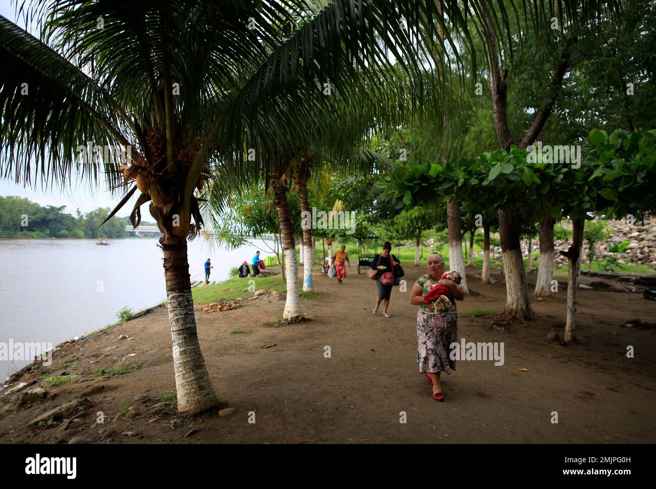 Commuters who arrived by raft across the Suchiate River from Guatemala ...