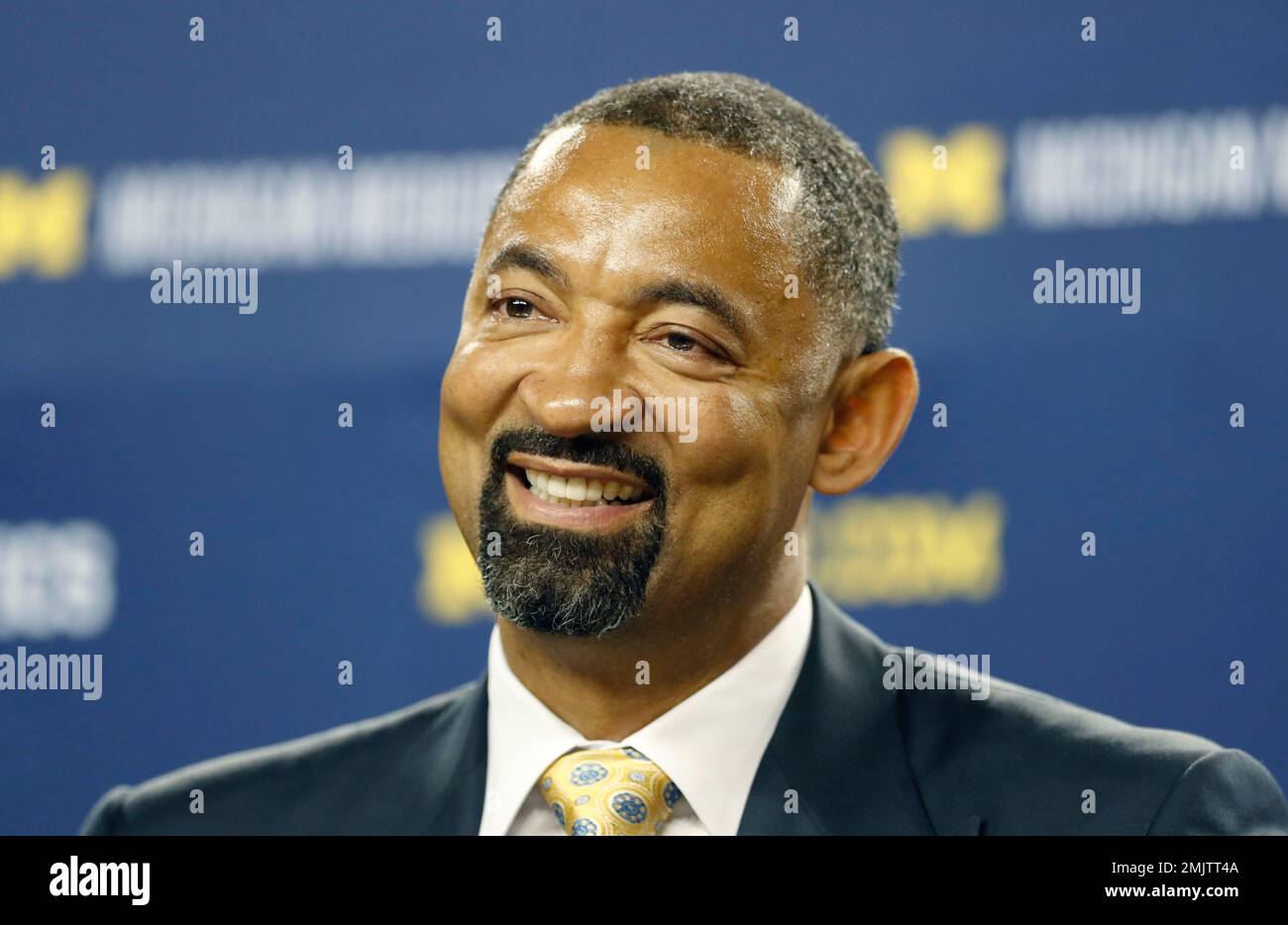 Juwan Howard smiles during his introduction as Michigan's new men's ...