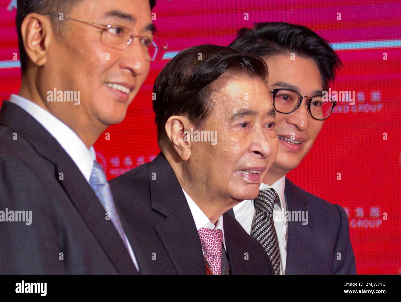 Henderson Land Development's founder and chairman Lee Shau-kee, center ...