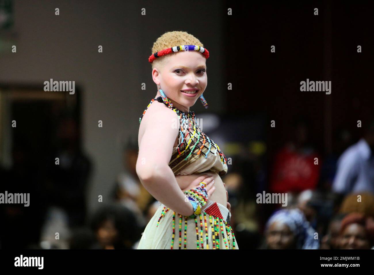 A contestant smiles while on stage during the Mr and Miss Zimbabwe ...