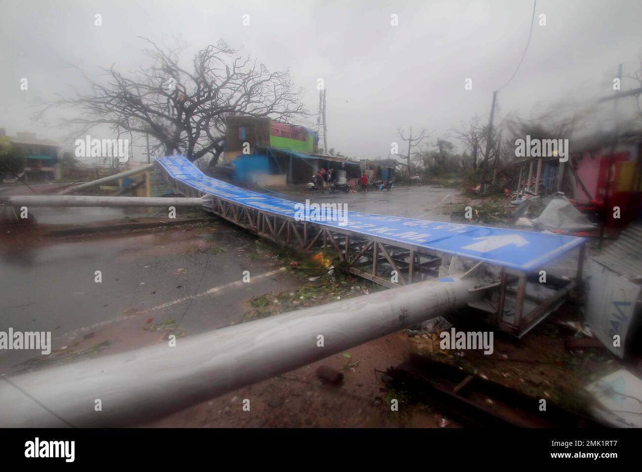 Damaged signage lies on a street in Puri district after Cyclone Fani ...
