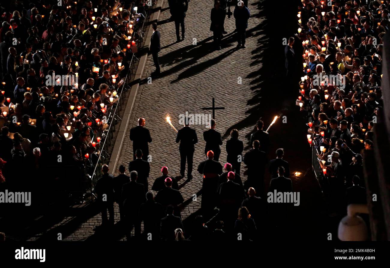 Faithful attend the Via Crucis (Way of the Cross) torchlight procession ...