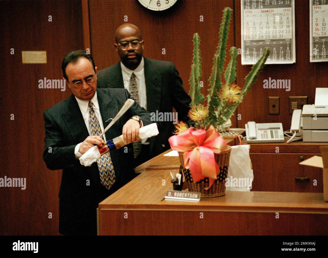 O.J. Simpson defense attorney Robert Shapiro, front, and prosecutor ...