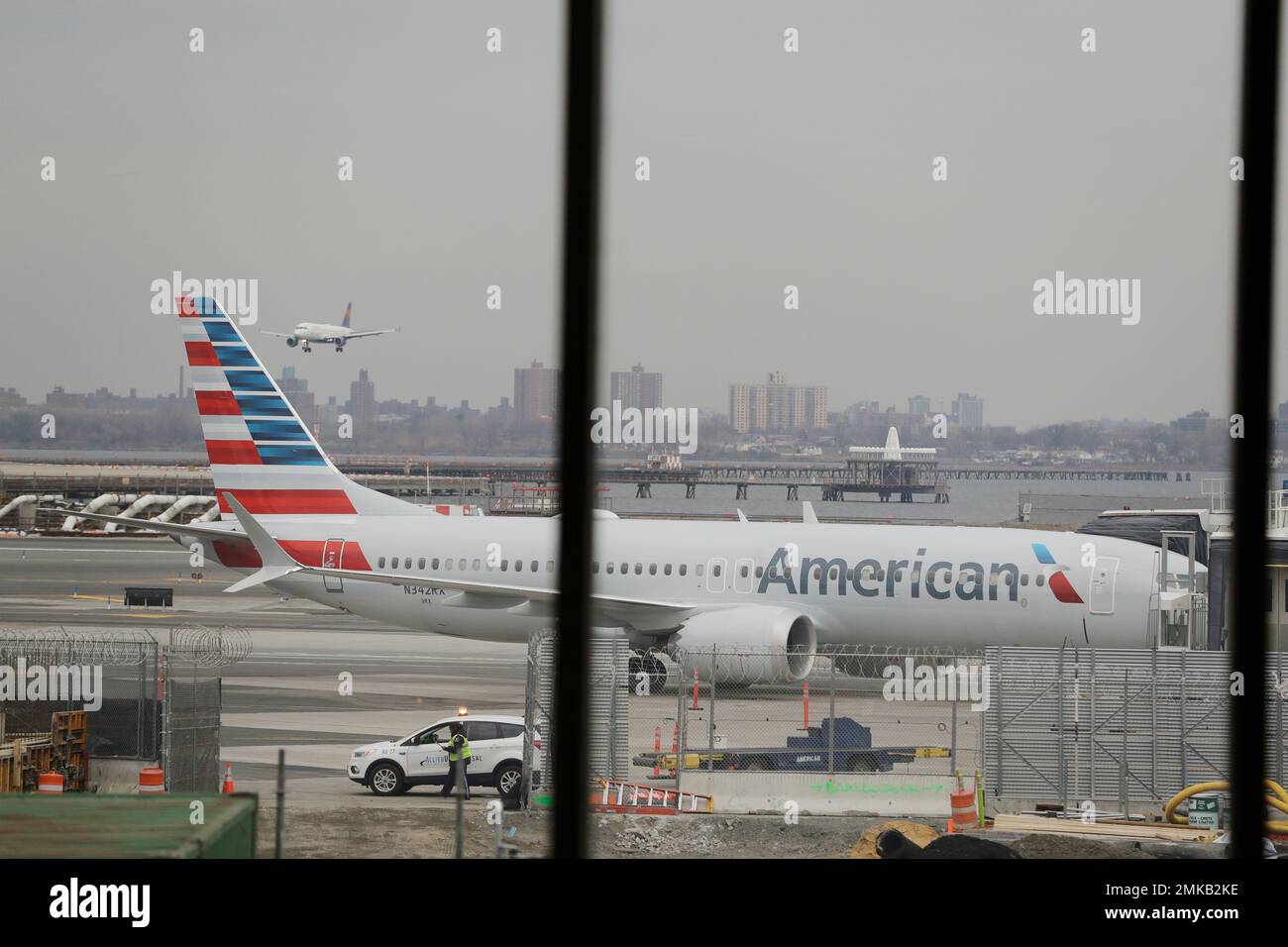 An American Airlines Boeing 737 MAX 8 sits at a boarding gate at ...