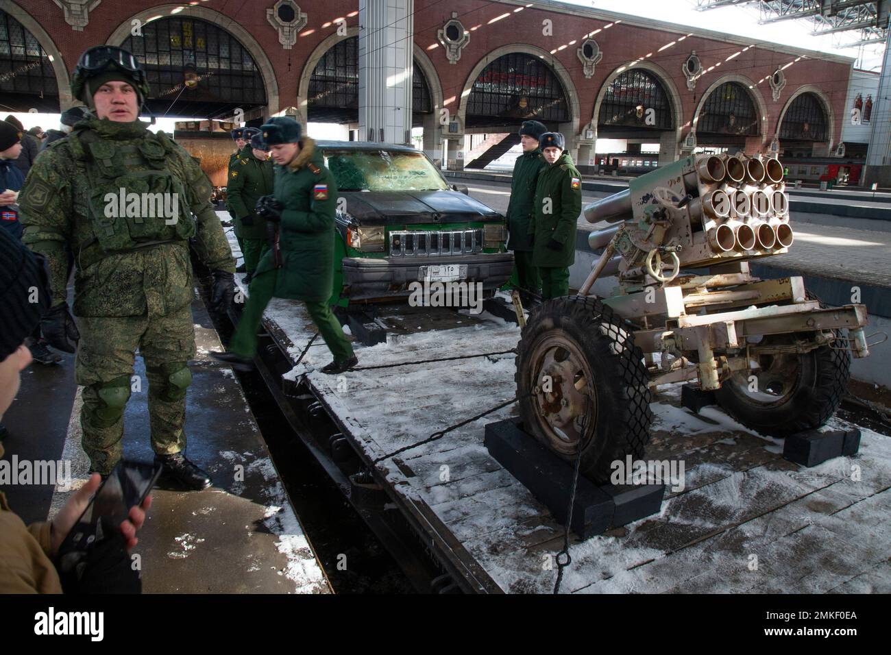 Russian soldiers stand next to a homemade mortar, standing aboard a train that has begun a ...