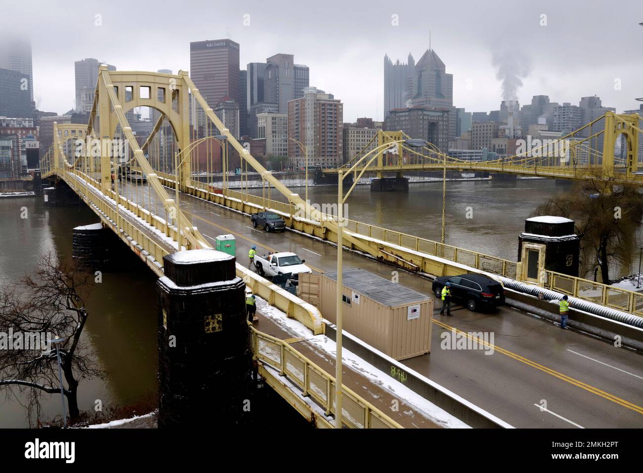 Workers prepare the Rachel Carson Bridge, left, between downtown ...