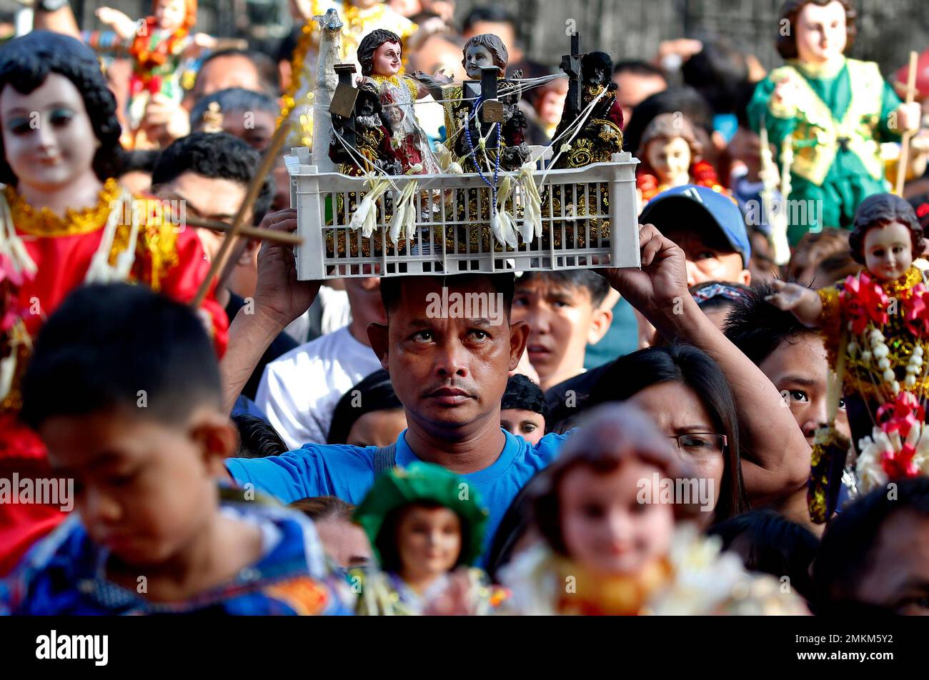 Roman Catholic devotees raise hundreds of images of the Child Jesus ...