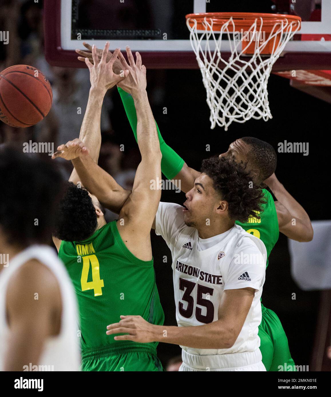 Arizona State's Taeshon Cherry (35) slaps the ball away from Oregon's ...