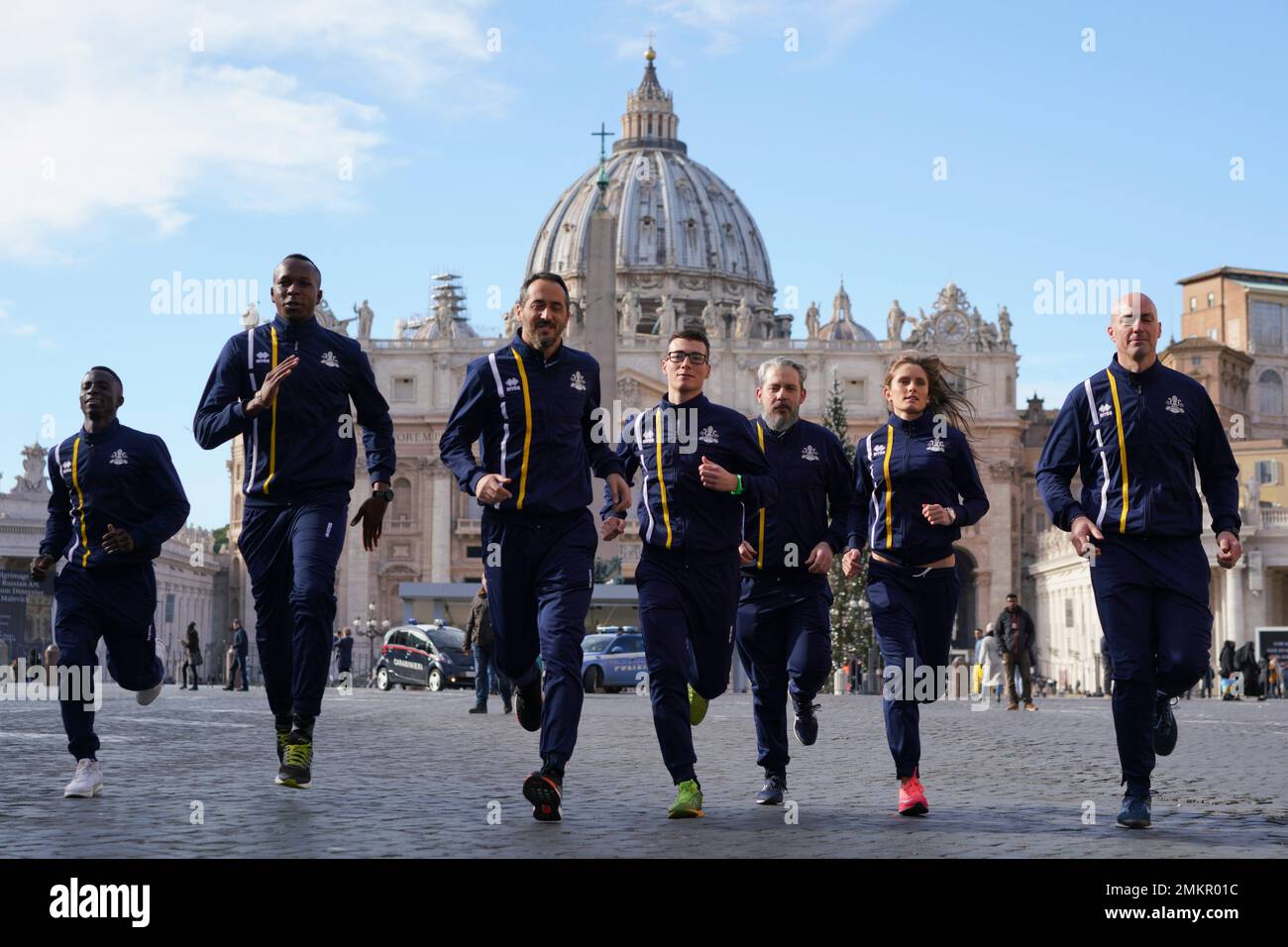 Athletes of the Athletic Vatican sports team run for the media in front ...