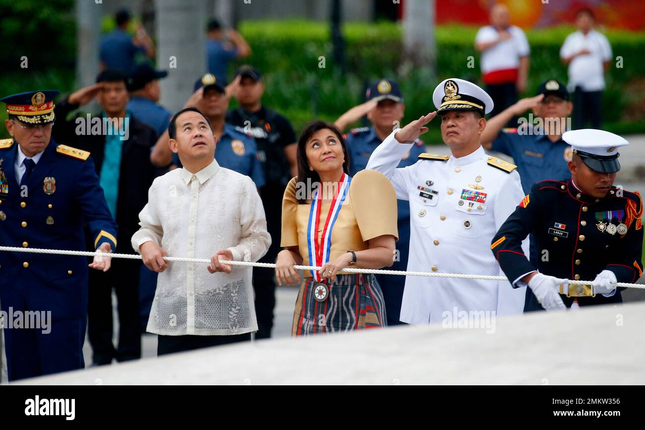 Philippine Vice President Maria Leonor "Leni" Robredo, center, leads ...