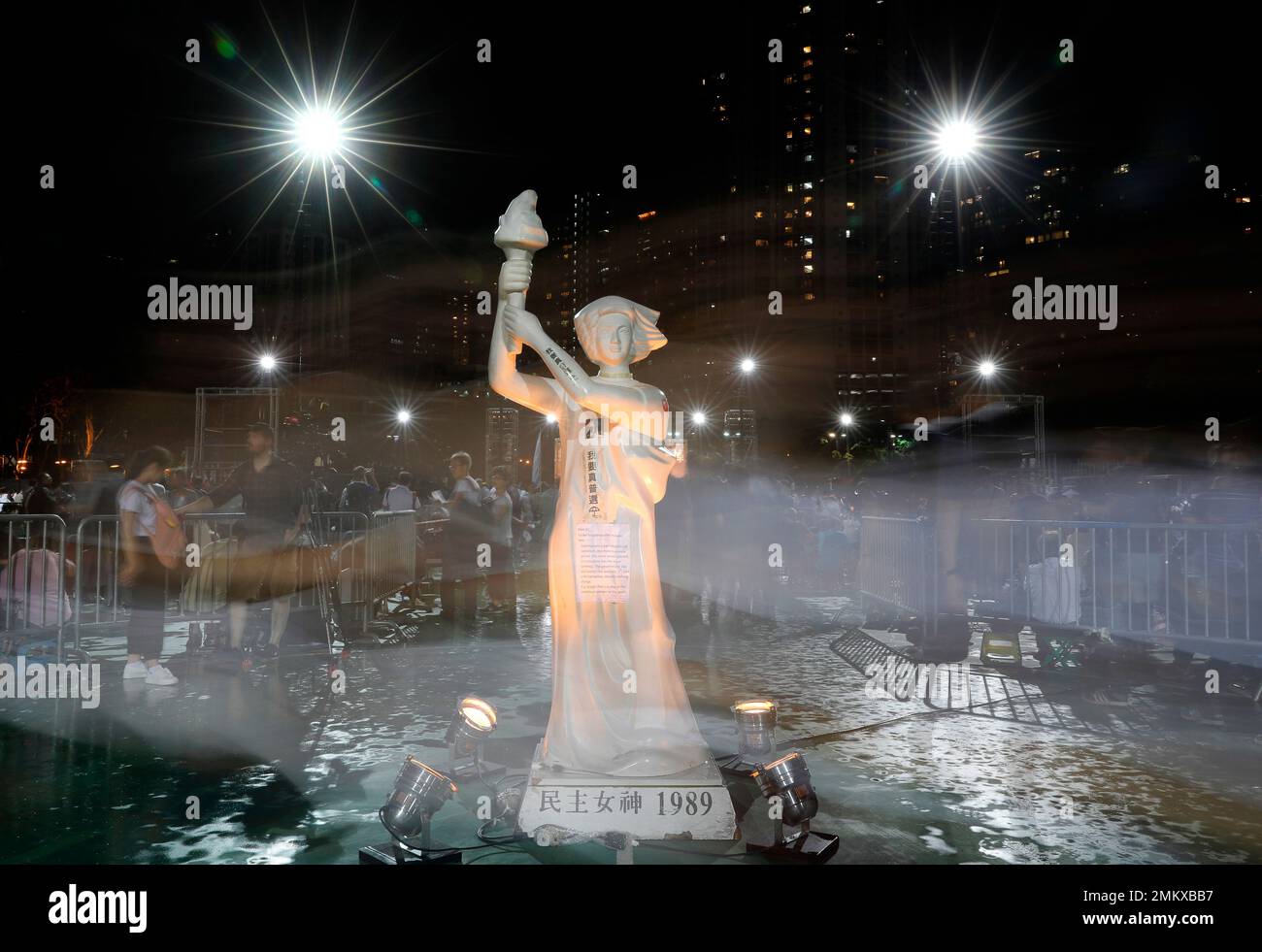 A statue of the "Goddess of Democracy" is displayed as tens of ...