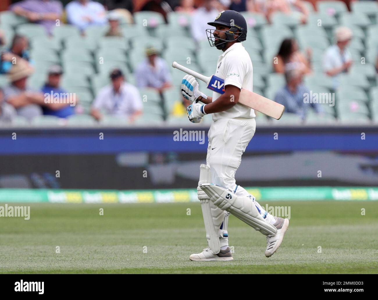 India's Rohit Sharma walks from the field after he was dismissed on day ...