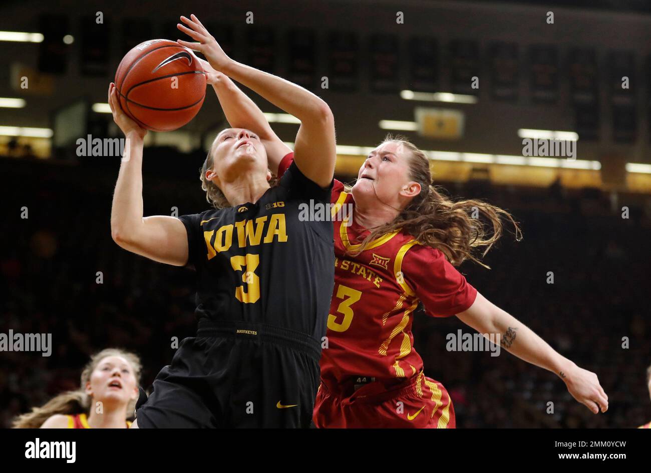 Iowa guard Makenzie Meyer is fouled by Iowa State guard Alexa Middleton ...