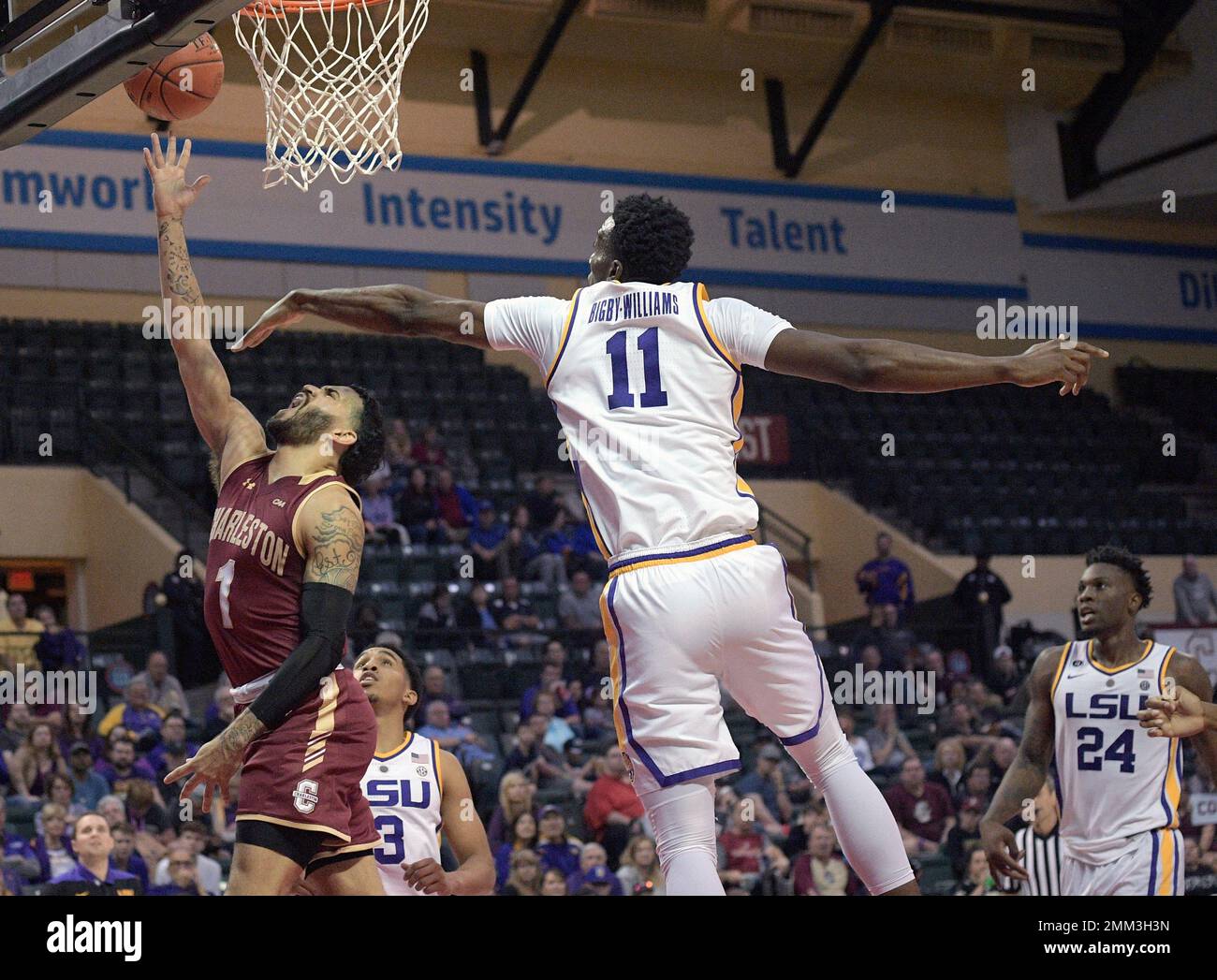 Charleston guard Grant Riller (1) goes up to shoot in front of LSU ...