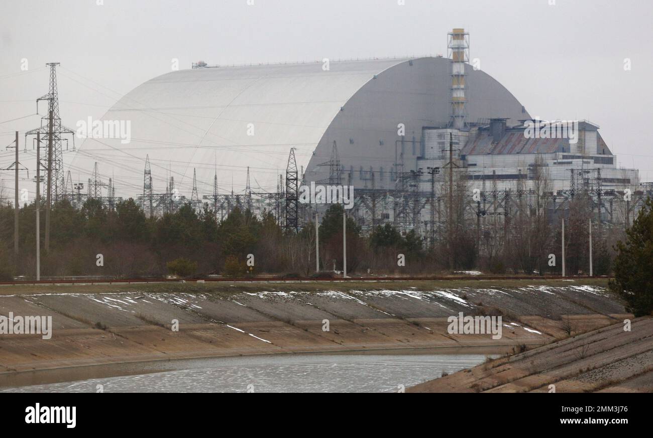 A new shelter installed to cover the exploded reactor seen at the ...