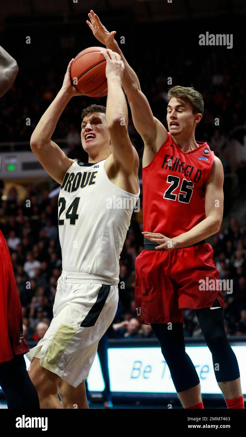Purdue forward Grady Eifert (24) attempts to shoot the basketball ...