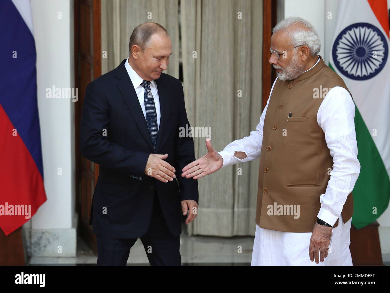 Indian Prime Minister Narendra Modi, right, stretches his arm out for a ...