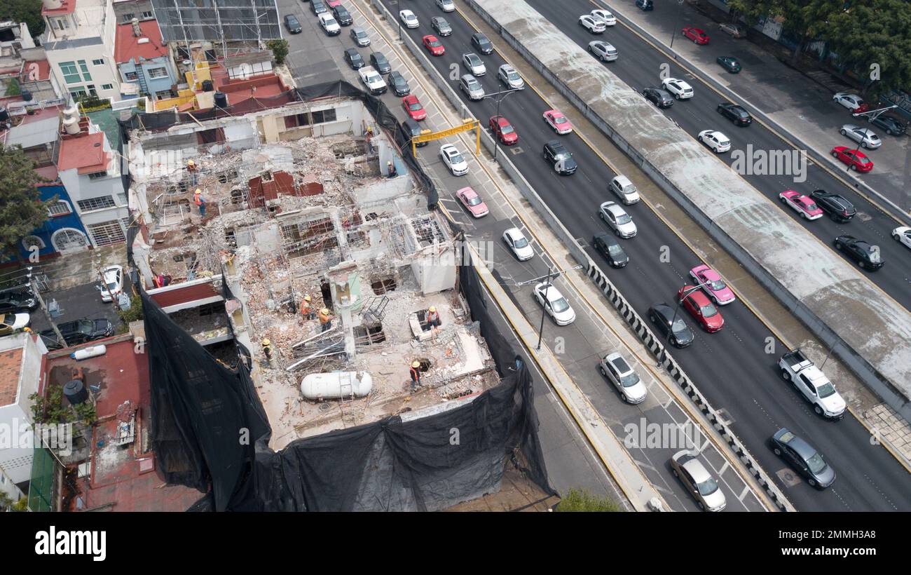 In this Sept. 13, 2018 photo, workers demolish an apartment building ...