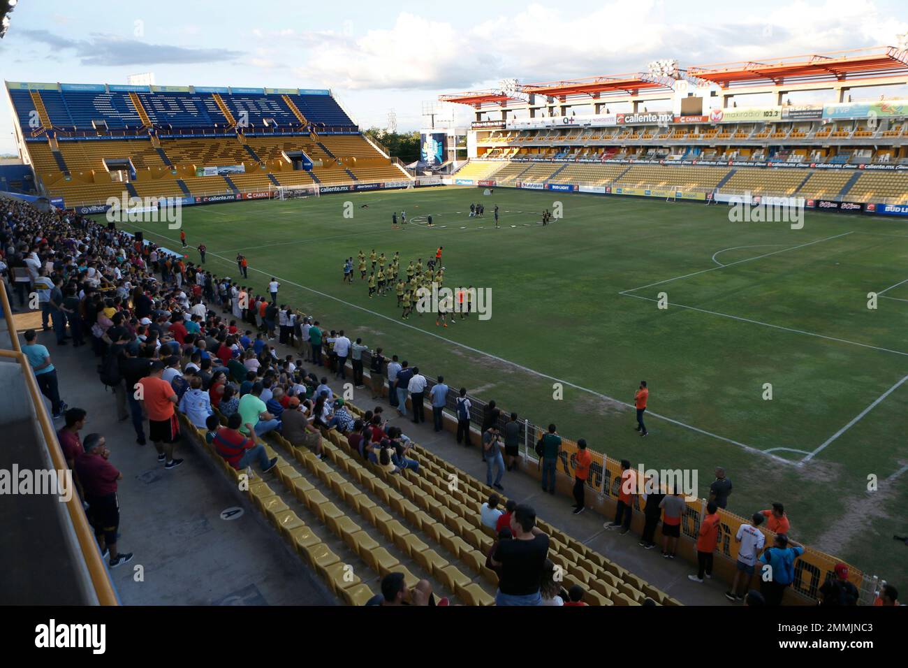 Fans watch from the stands as former soccer great Diego Maradona leads ...